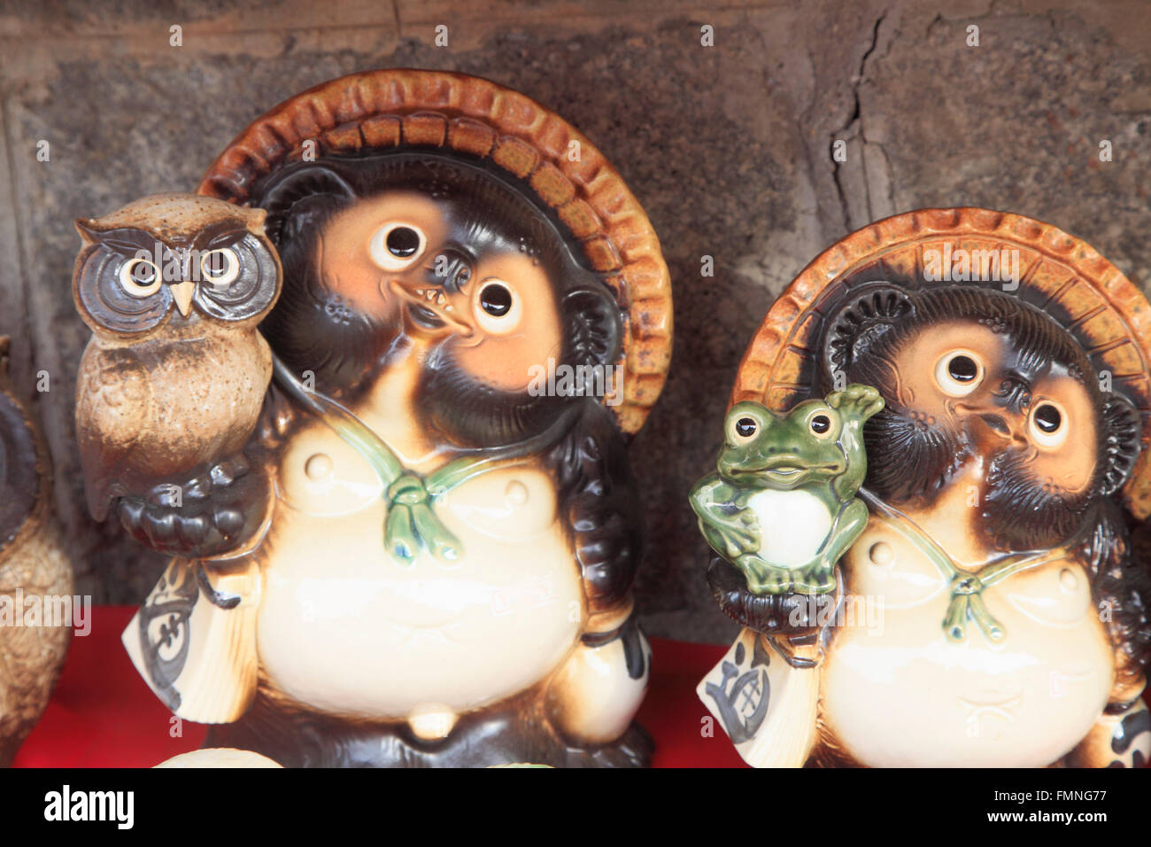 Japan; Kyoto; Fushimi Inari Taisha Shrine, tanuki, racoon, statues ...