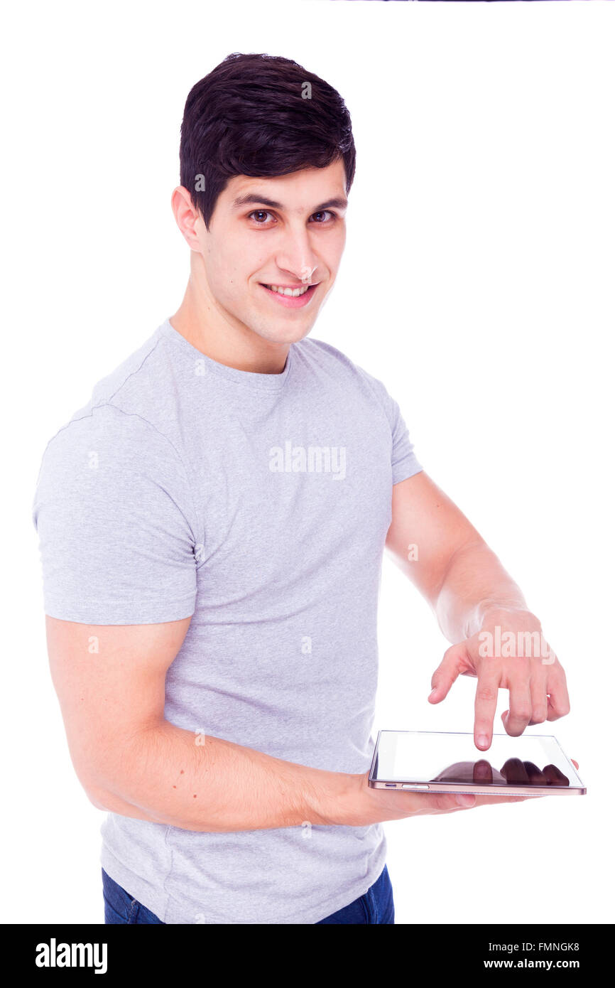Handsome latin man using a tablet computer, isolated over a white ...
