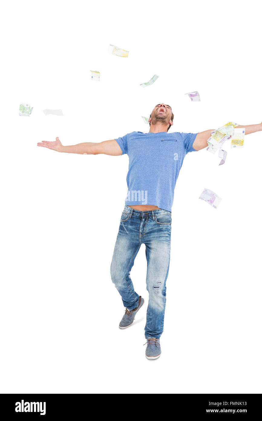 Young man throwing currency notes Stock Photo - Alamy