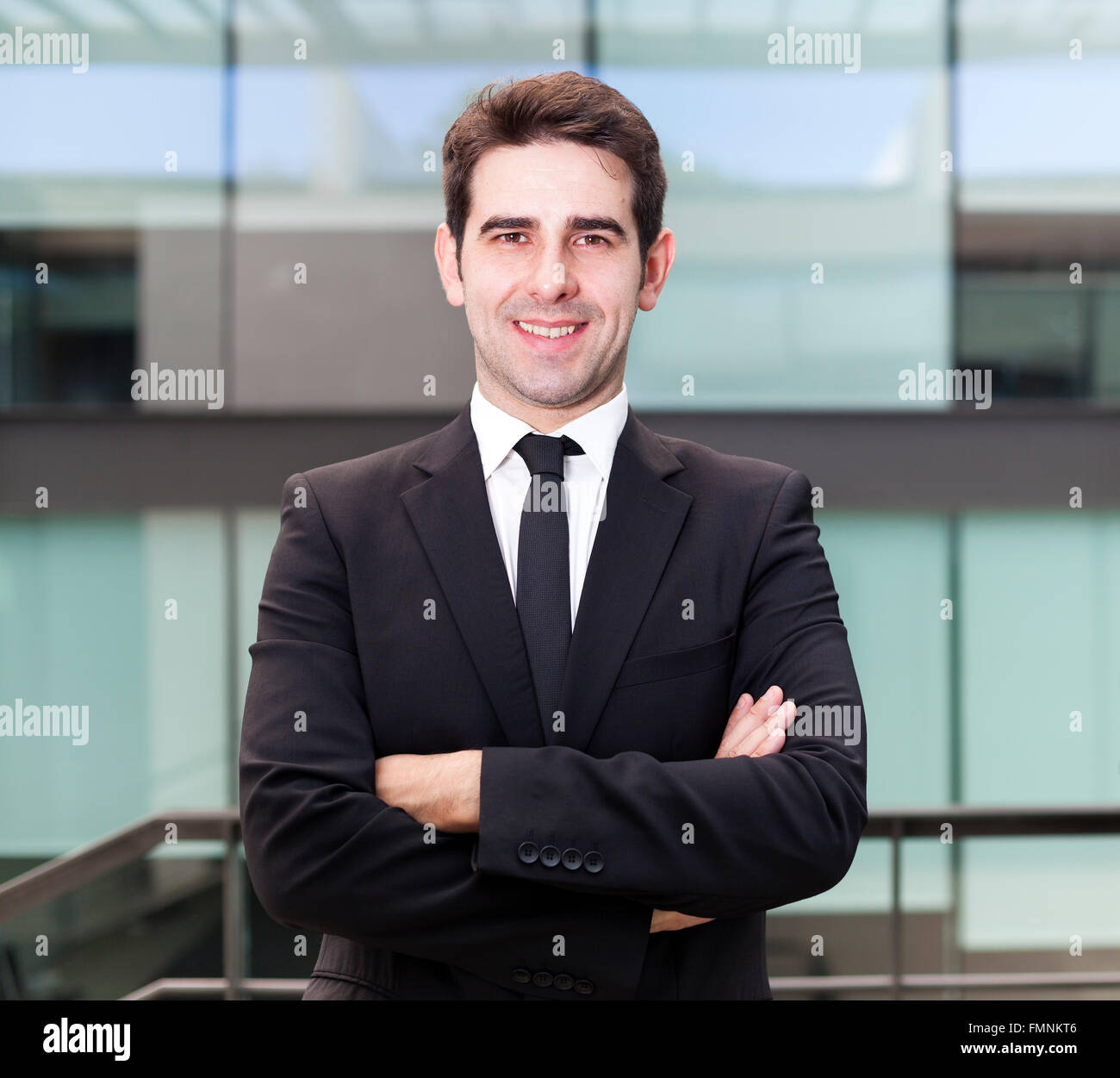 Portrait of a smiling handsome business man at office building Stock ...