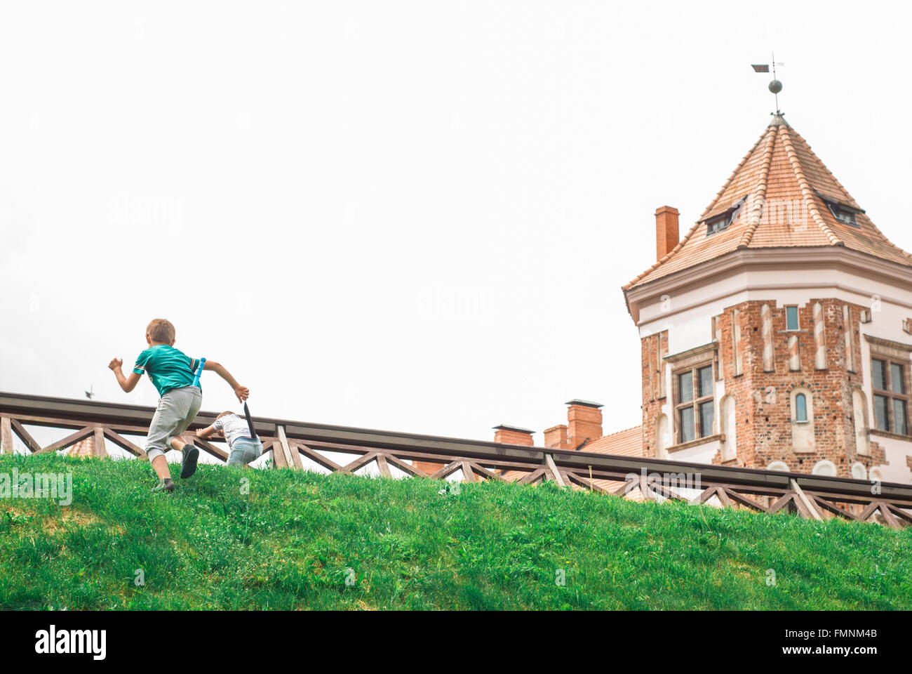A child plays on the background of the Mir castle Stock Photo - Alamy