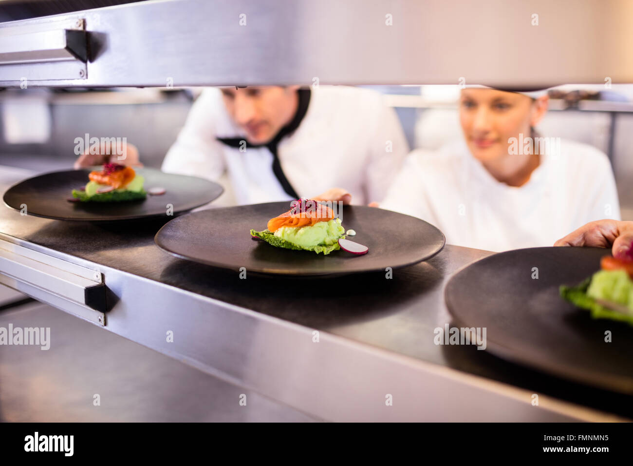 Male chef keeping appetizer plate hi-res stock photography and images ...