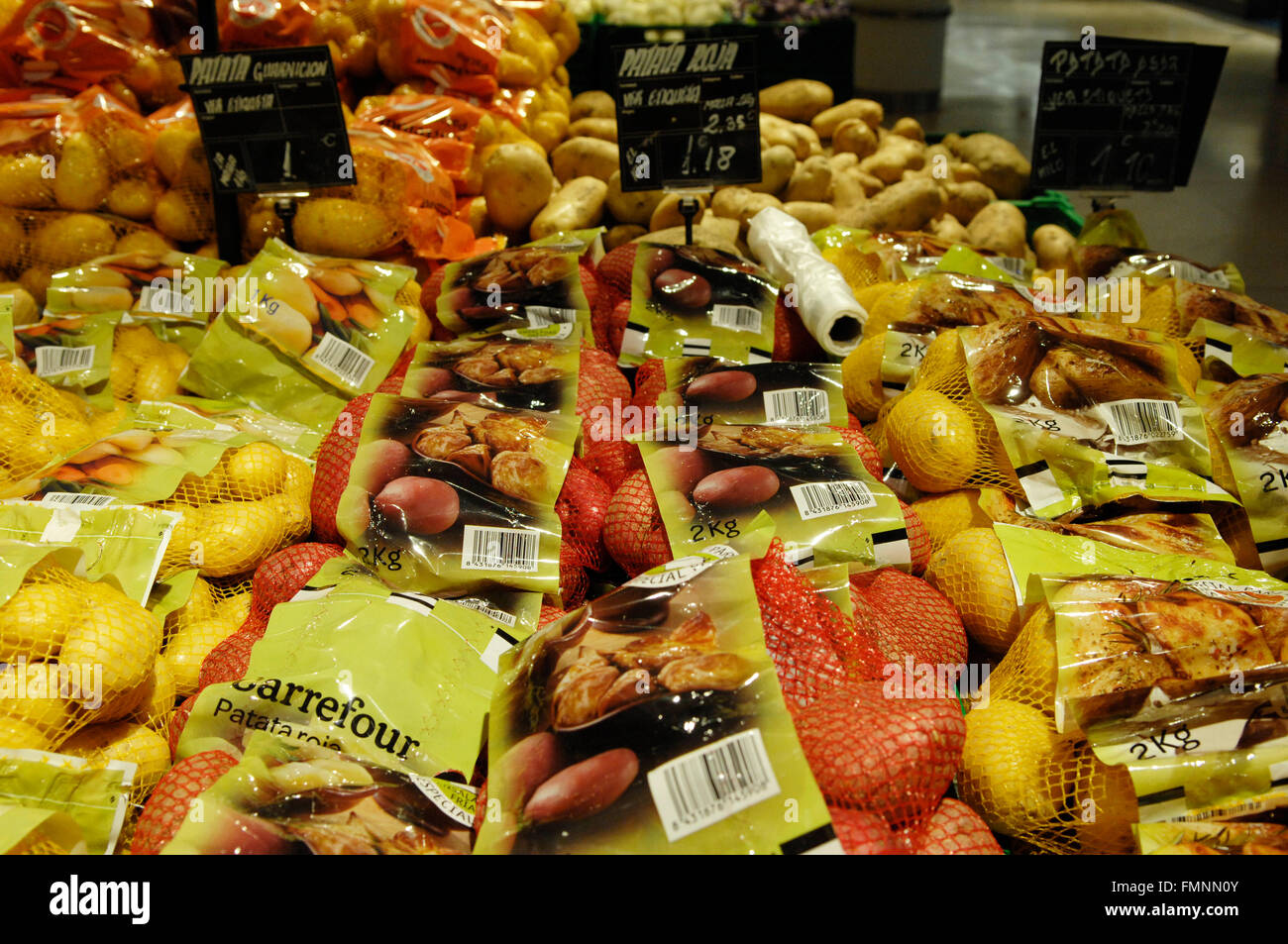 A image of sweet and normal potatoes on display in carrefour, Spain ...