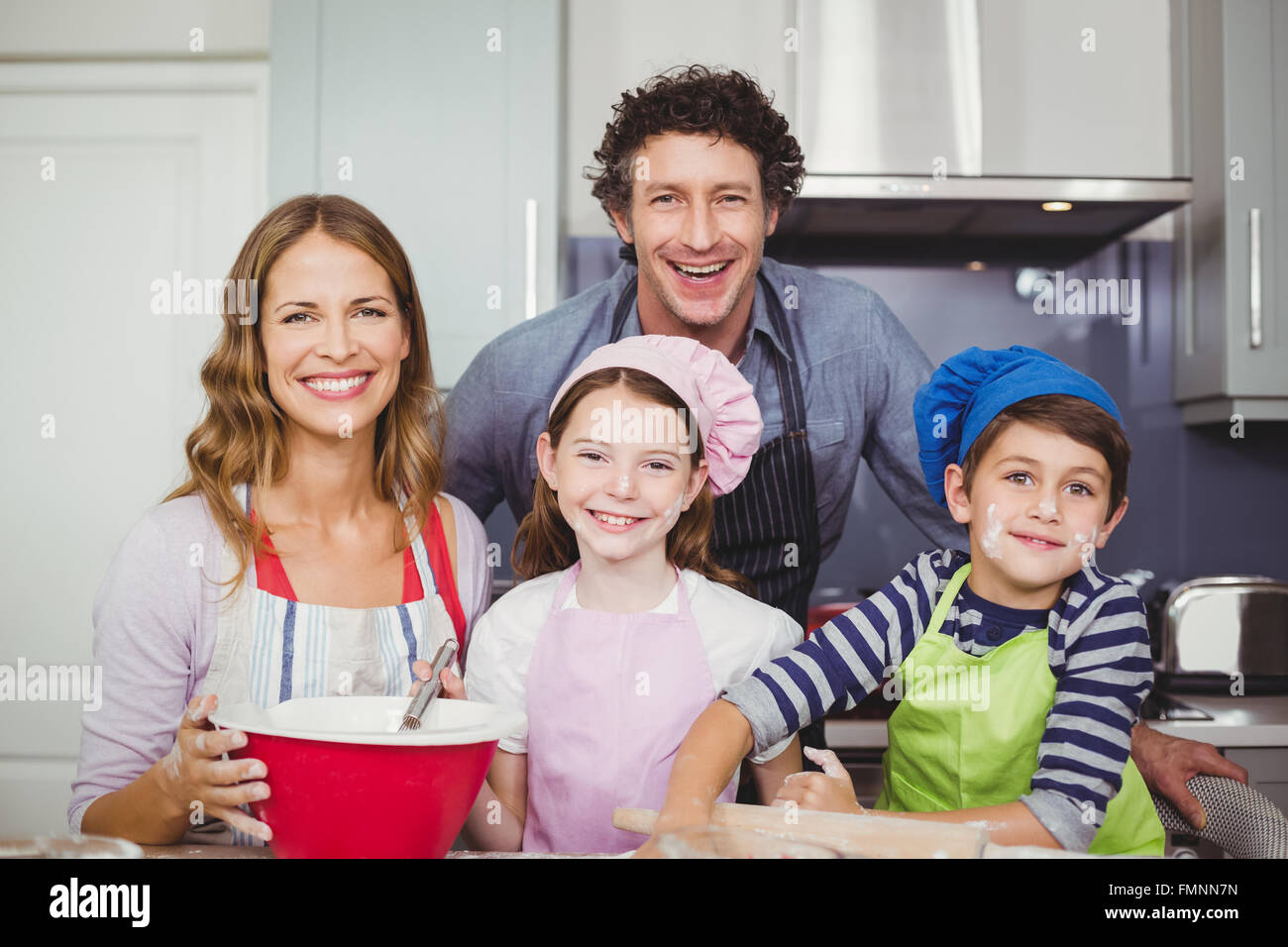 Portrait of happy family in kitchen Stock Photo - Alamy