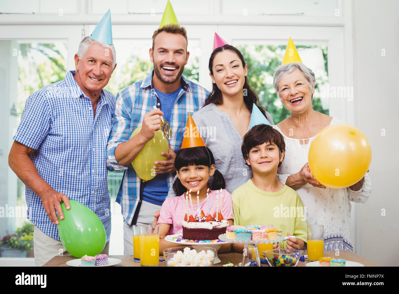 Portrait of happy multi generation family during birthday party Stock ...