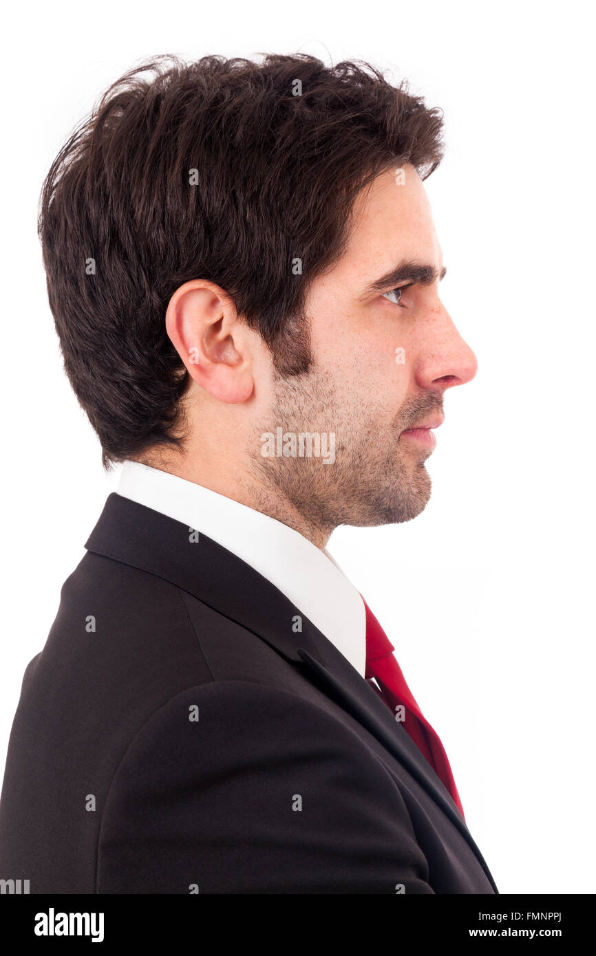 Closeup of a young business man from profile, isolated on white ...