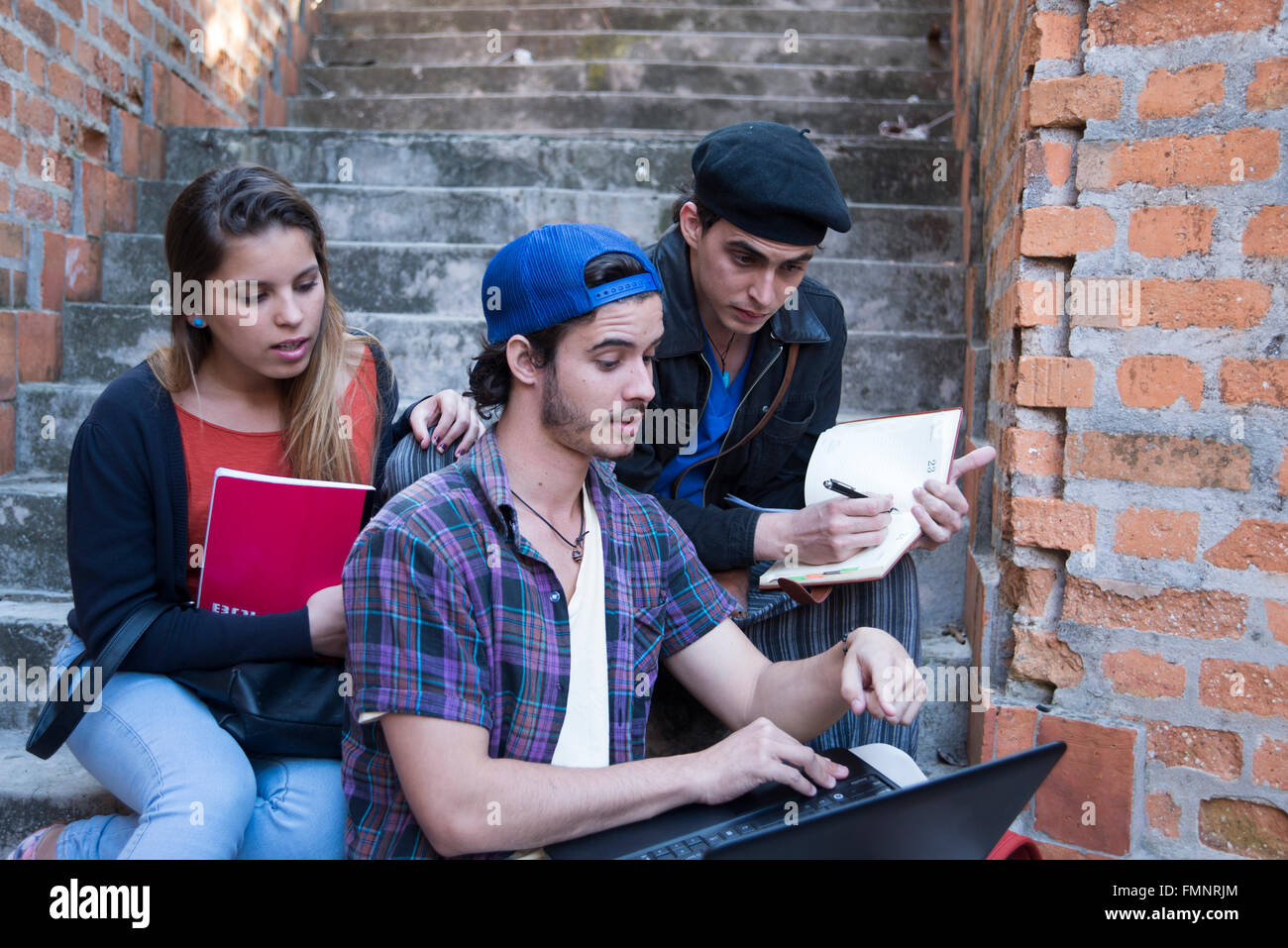 Three college students Stock Photo - Alamy