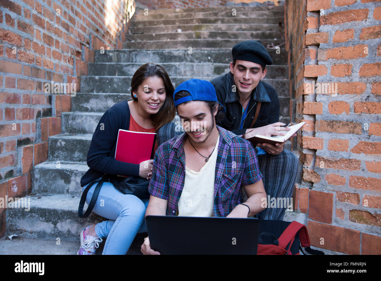 Three college students Stock Photo - Alamy