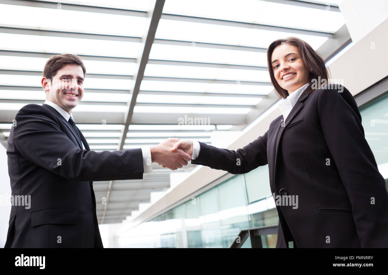 Handshake between business partners at modern office Stock Photo - Alamy