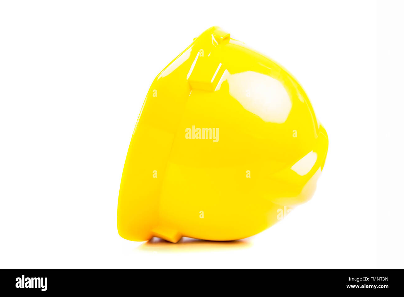 Yellow helmet isolated over white background Stock Photo - Alamy