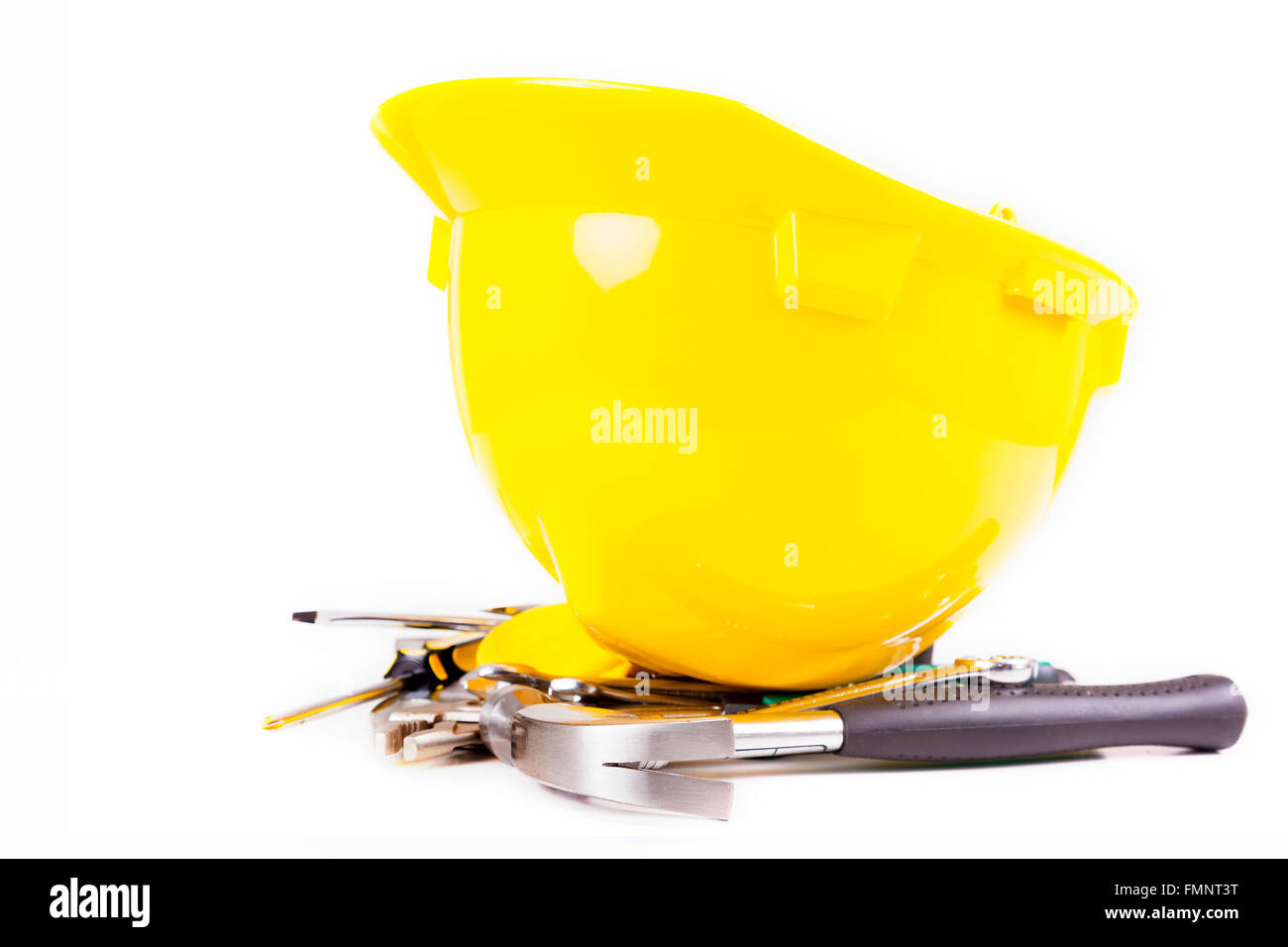 Yellow helmet and tools isolated over white background Stock Photo - Alamy