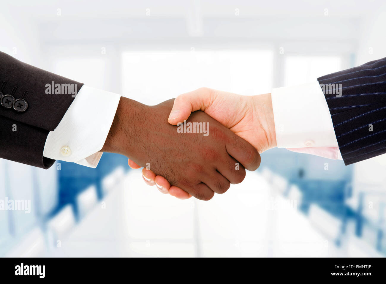 Meeting handshake between caucasian african hi-res stock photography ...