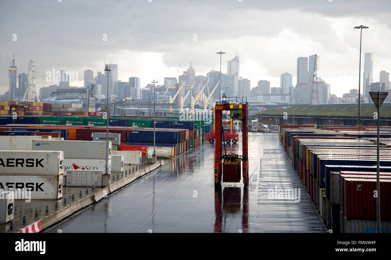Straddle container carrier on a rainy day in Port of Melbourne ...