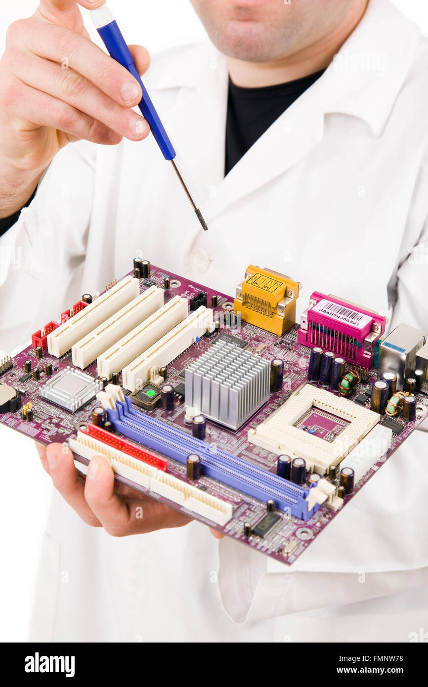 Computer Engineer examining/repairing a electronic circuit, isolated ...