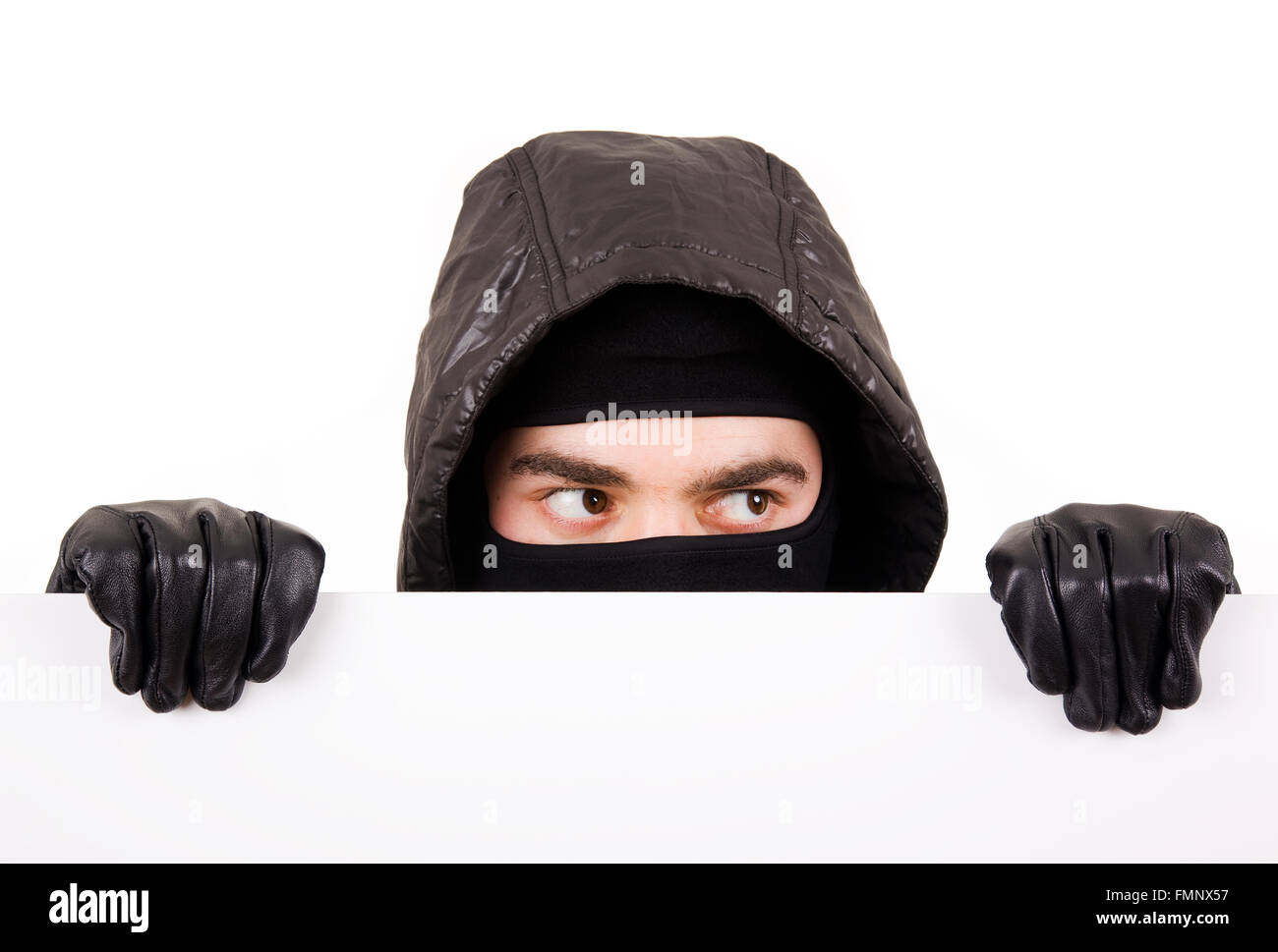 Thief hiding on white background Stock Photo - Alamy