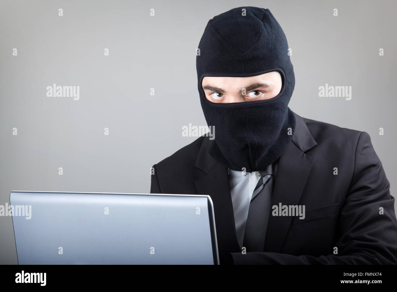 Computer Hacker in suit and tie Stock Photo - Alamy