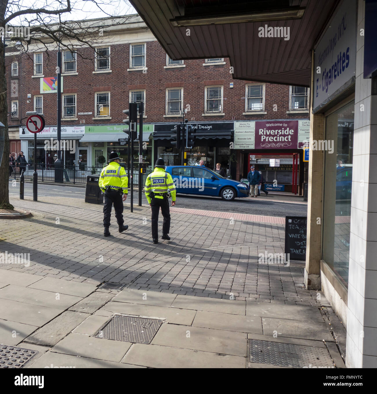Two male police officers patrol Rotherham town centre and shops Stock ...