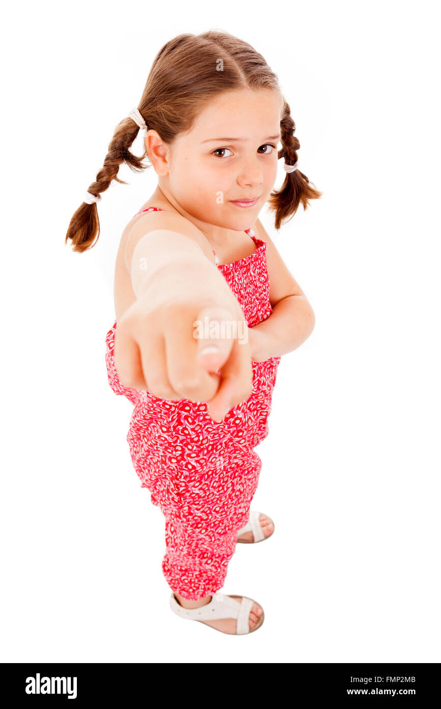 Full length portrait of a happy little girl pointing on white ...