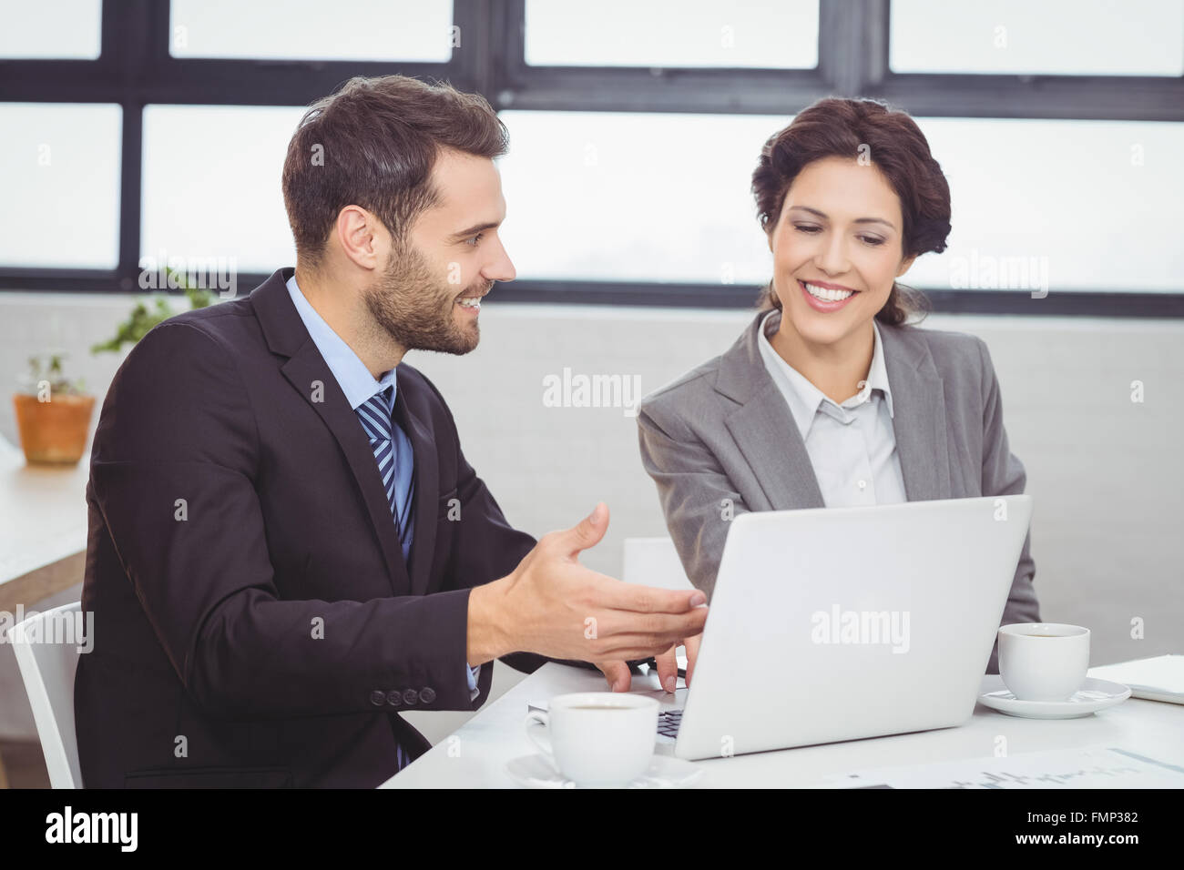 Business man standing looking over room hi-res stock photography and ...