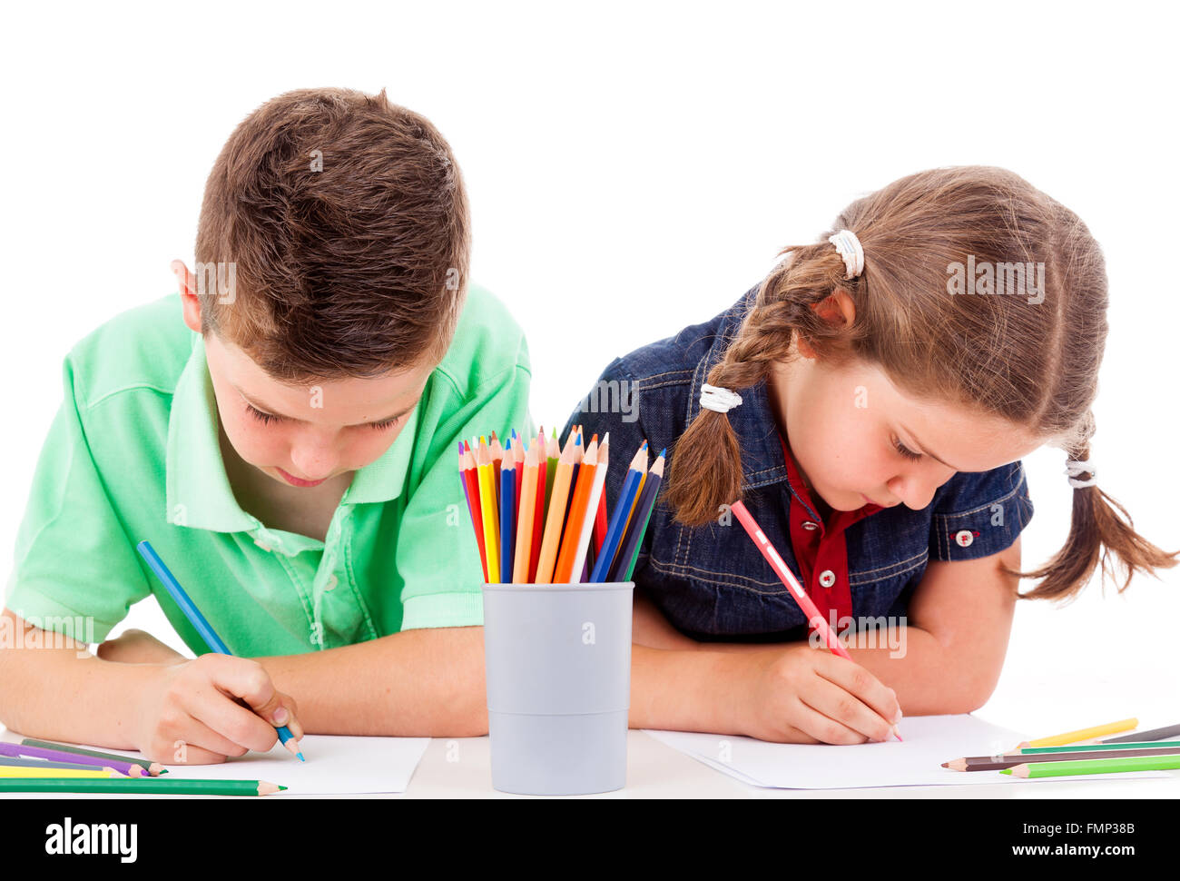 Two children drawing with colorful crayons, isolated over white Stock ...