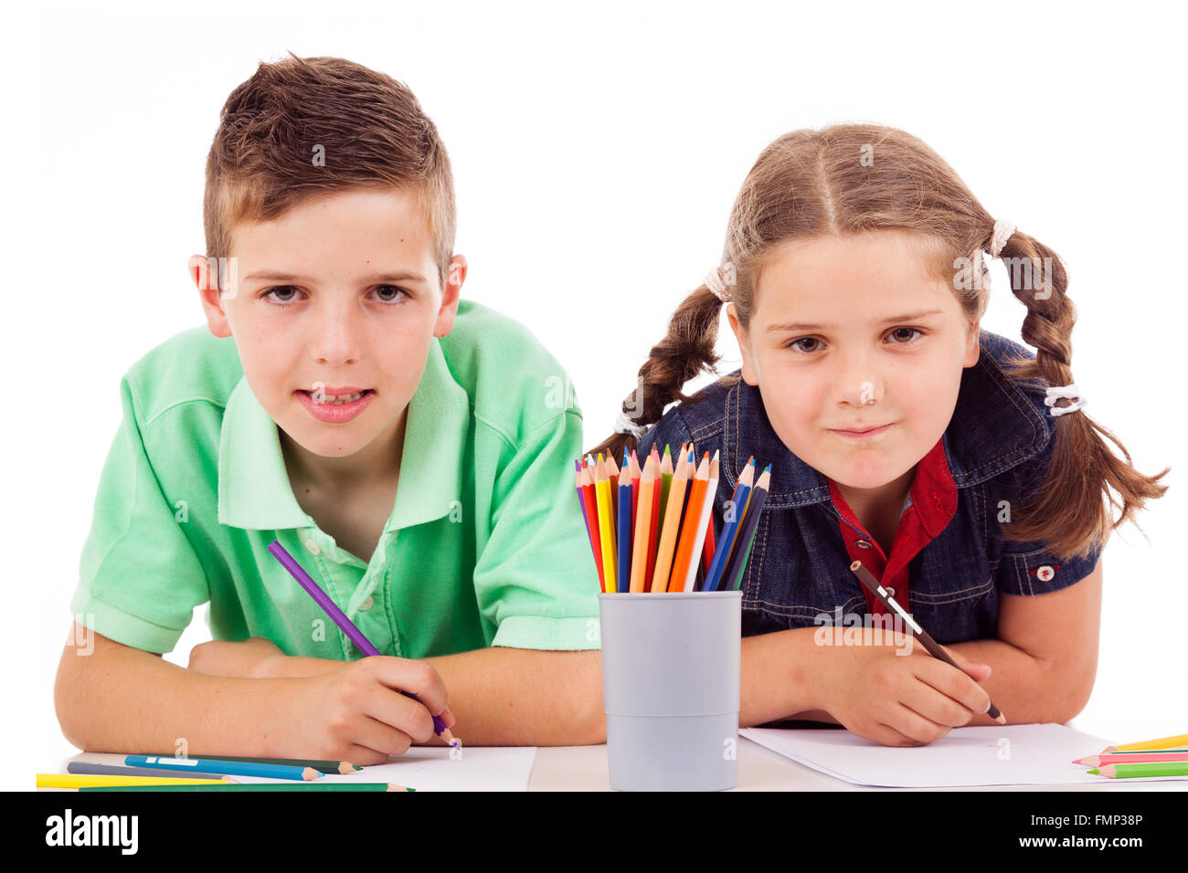 Two children drawing with colorful crayons and smile, isolated over ...