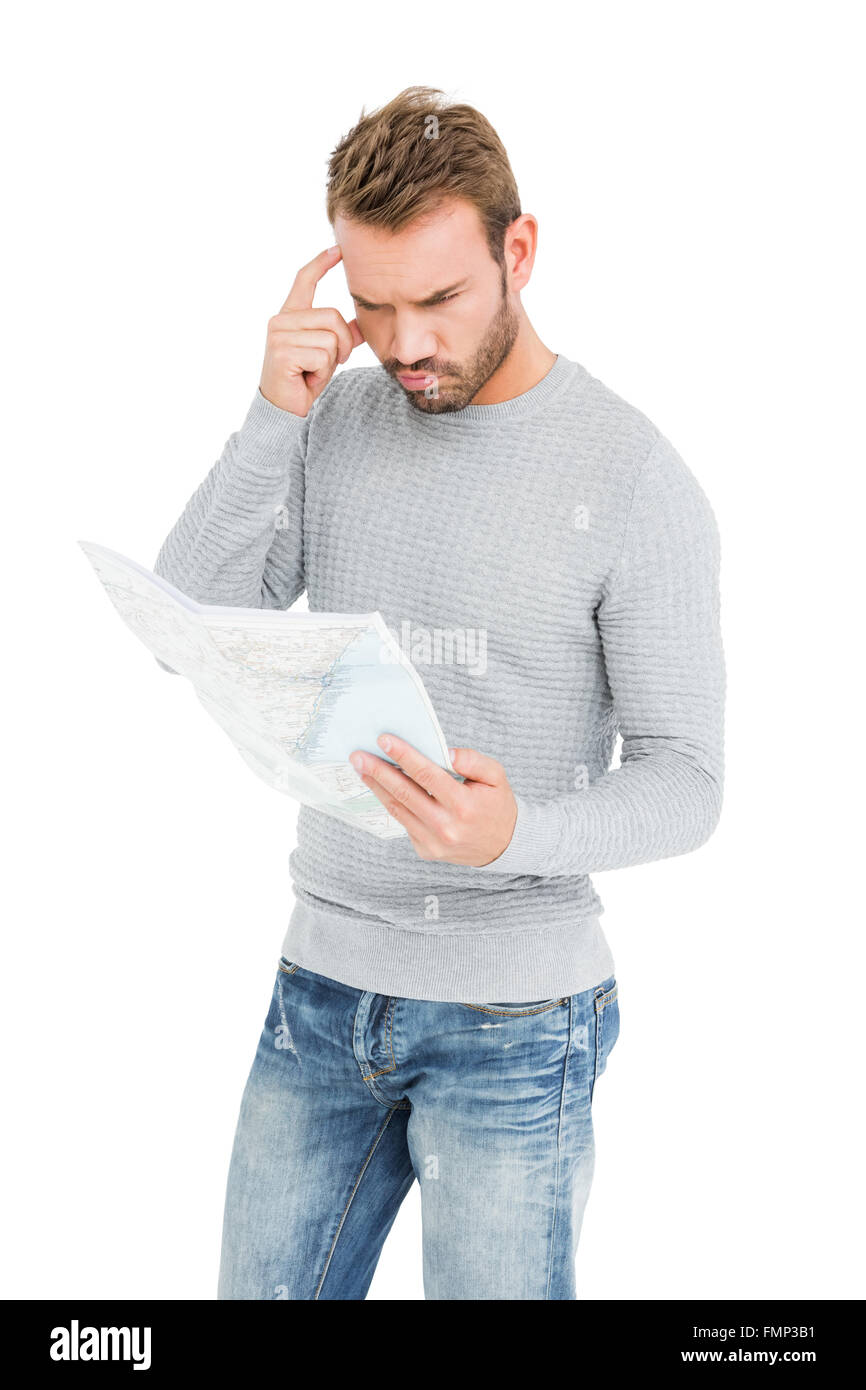 Young man looking at map Stock Photo - Alamy