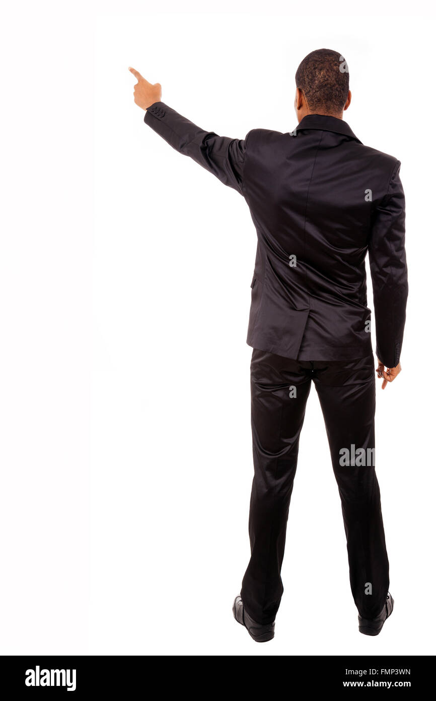 Full length of a African business man pointing at copyspace isolated ...