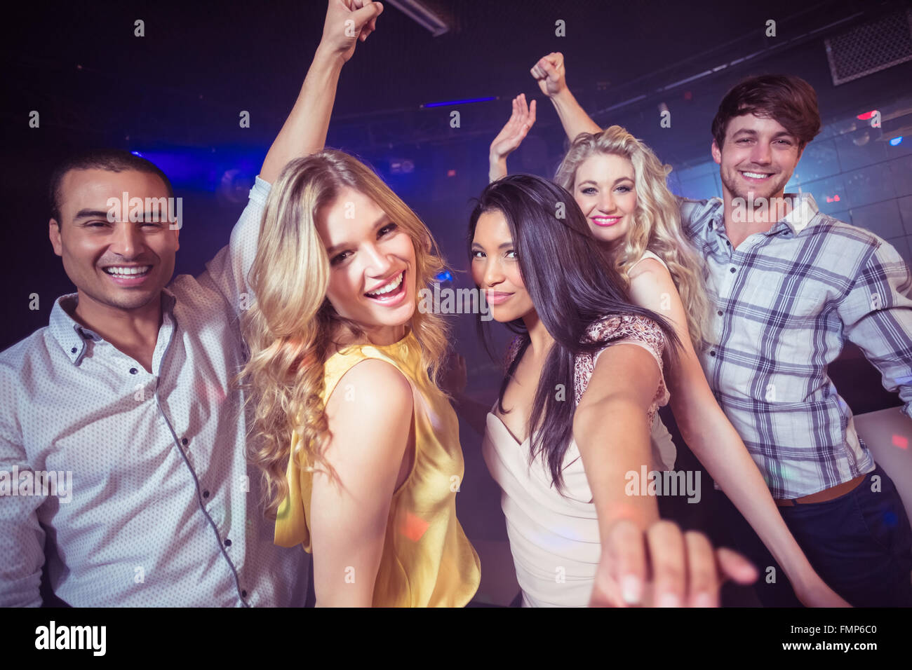 Happy friends dancing Stock Photo - Alamy
