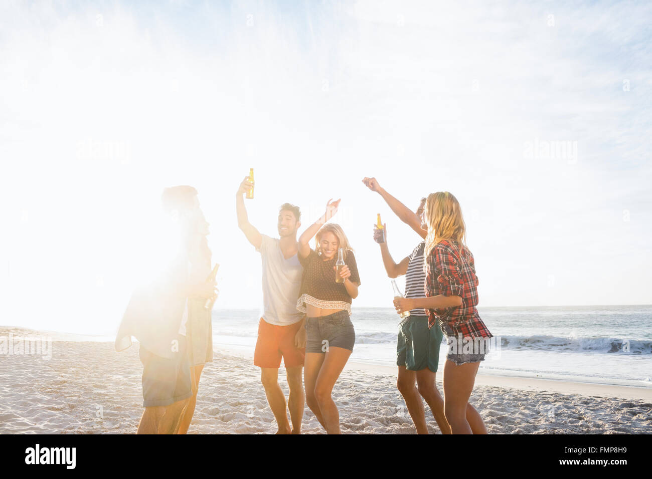 Happy friends dancing together Stock Photo - Alamy