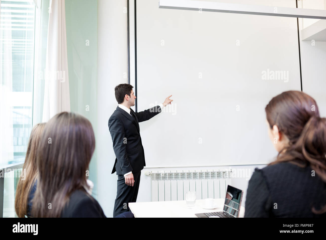 Business man making a presentation at the office Stock Photo - Alamy