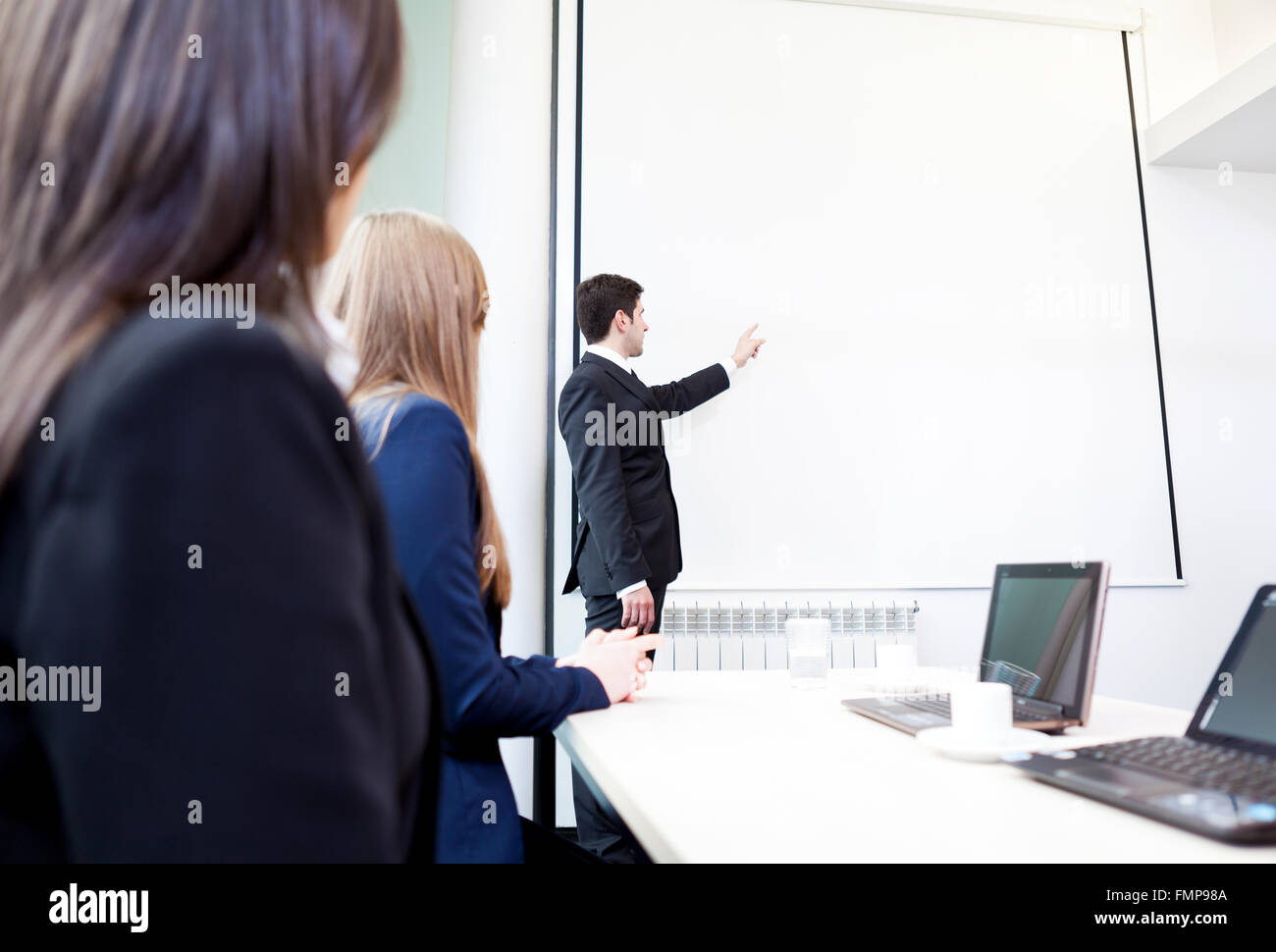 Business man making a presentation at the office Stock Photo - Alamy