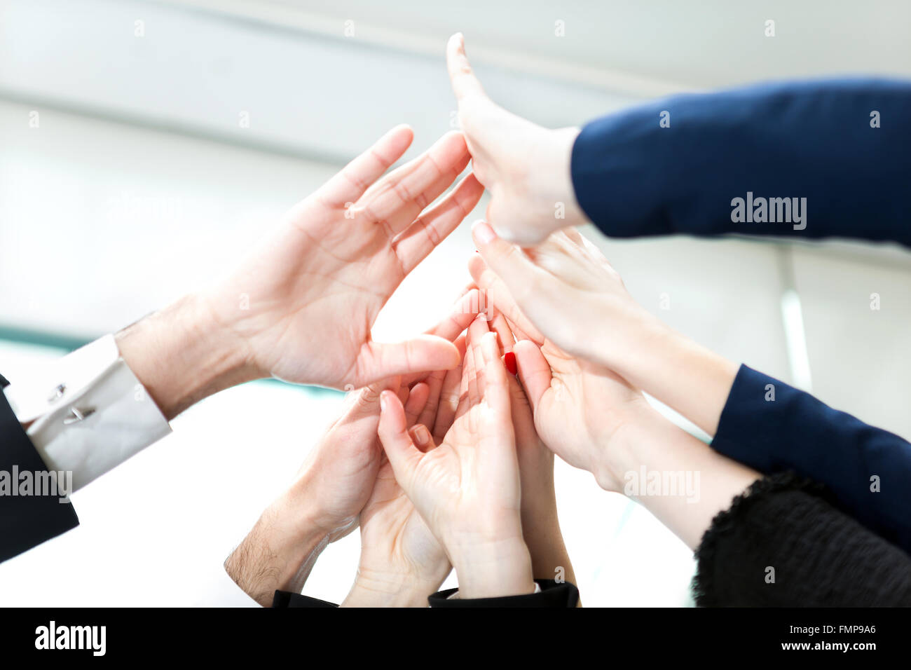 Closeup of hands of business people giving high-five Stock Photo - Alamy