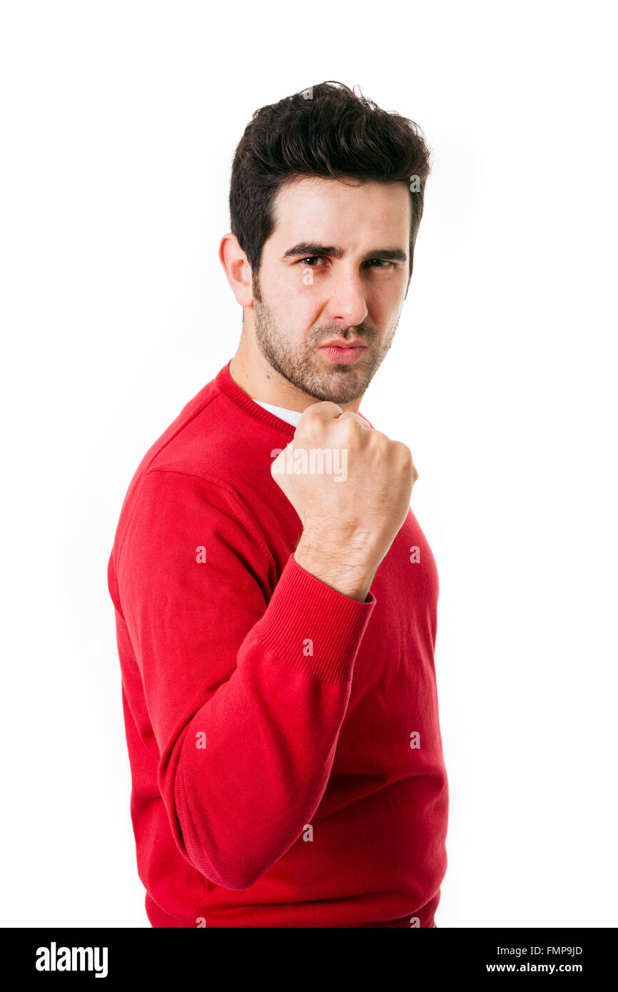 portrait of young man winner gesture against a white background Stock ...