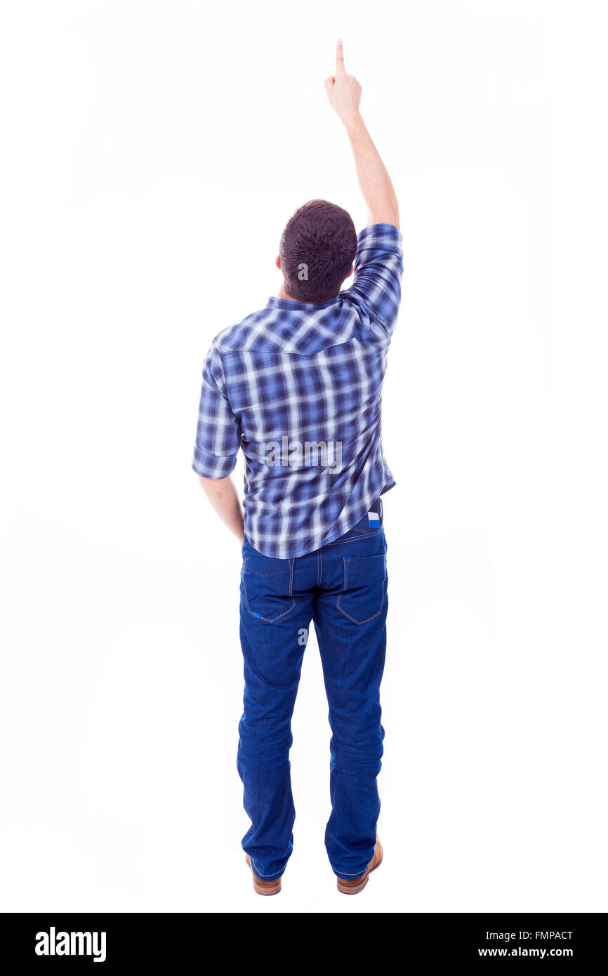 Back view of young man pointing up, isolated over white background ...