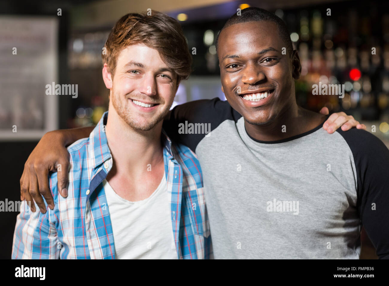 Portrait of smiling friends together Stock Photo - Alamy