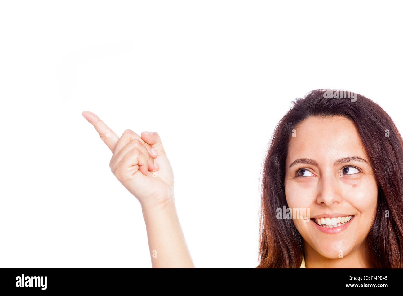 Portrait of a young beautiful woman pointing at copyspace Stock Photo ...
