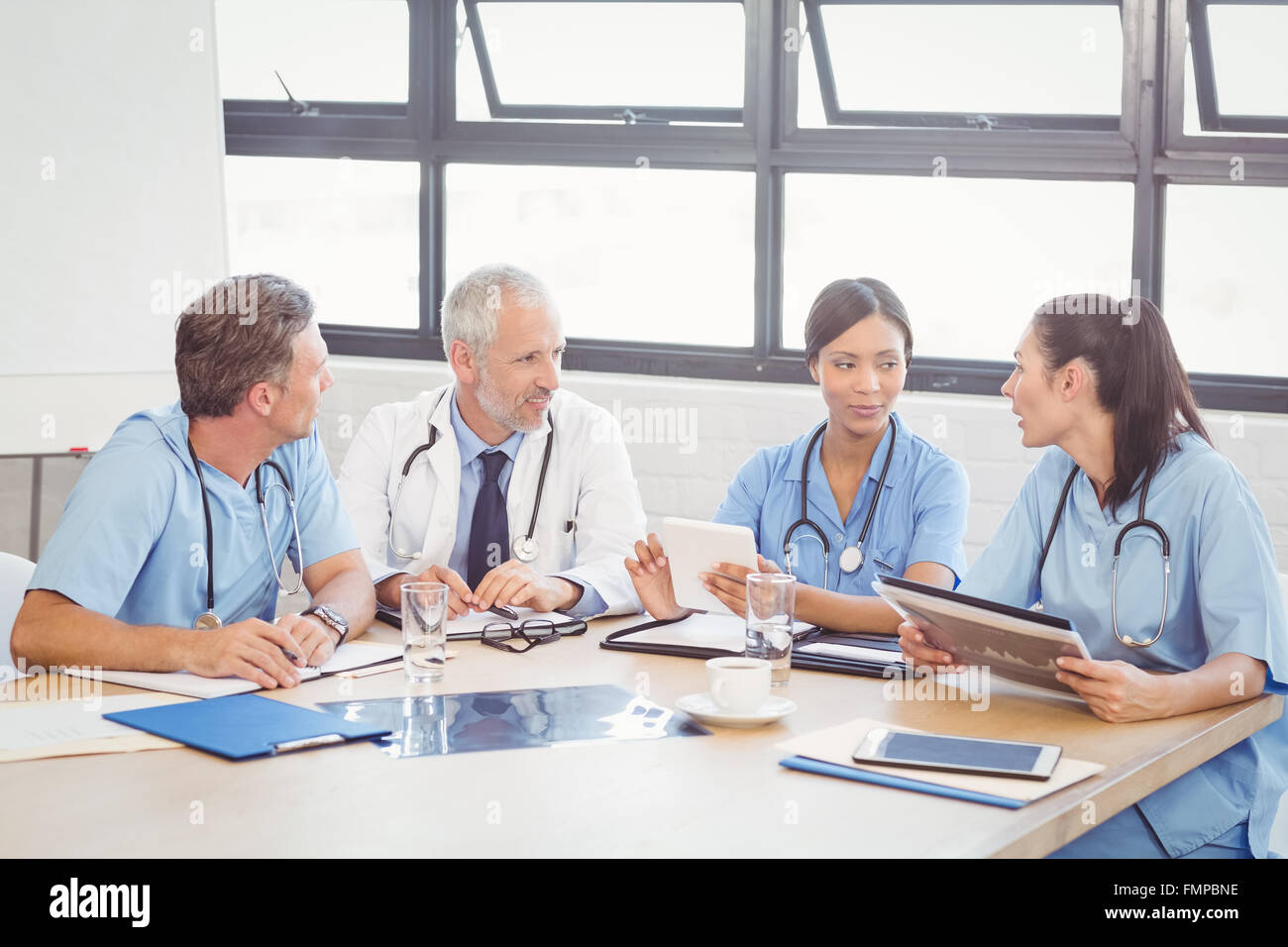 Medical team interacting in conference room Stock Photo - Alamy
