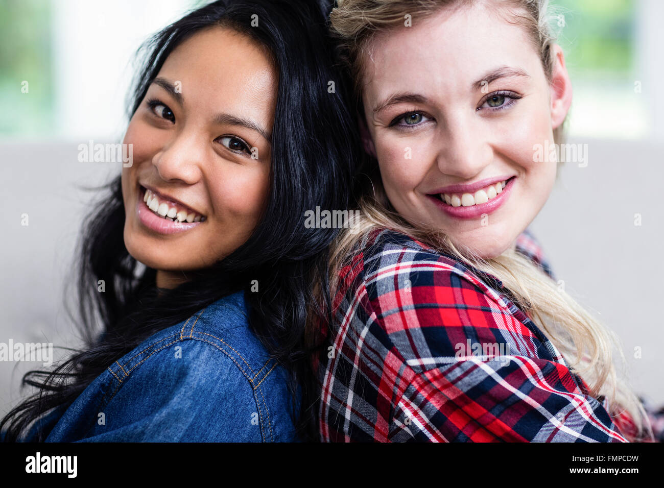 Portrait of cheerful beautiful female friends Stock Photo - Alamy