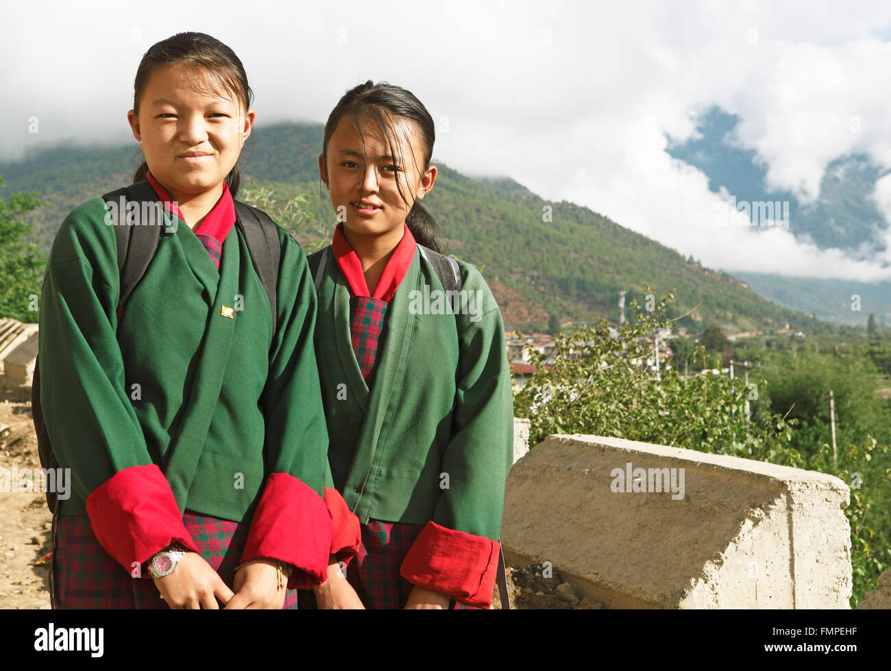 Girls wearing the traditional Kira dress in Paro, the Himalayas ...