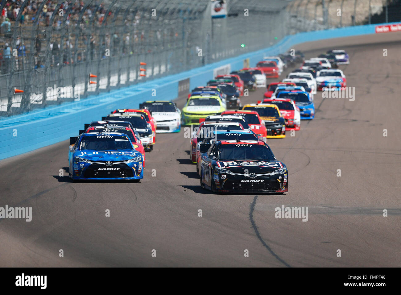 Avondale, AZ, USA. 12th Mar, 2016. Matt Kenseth (20) battles for ...