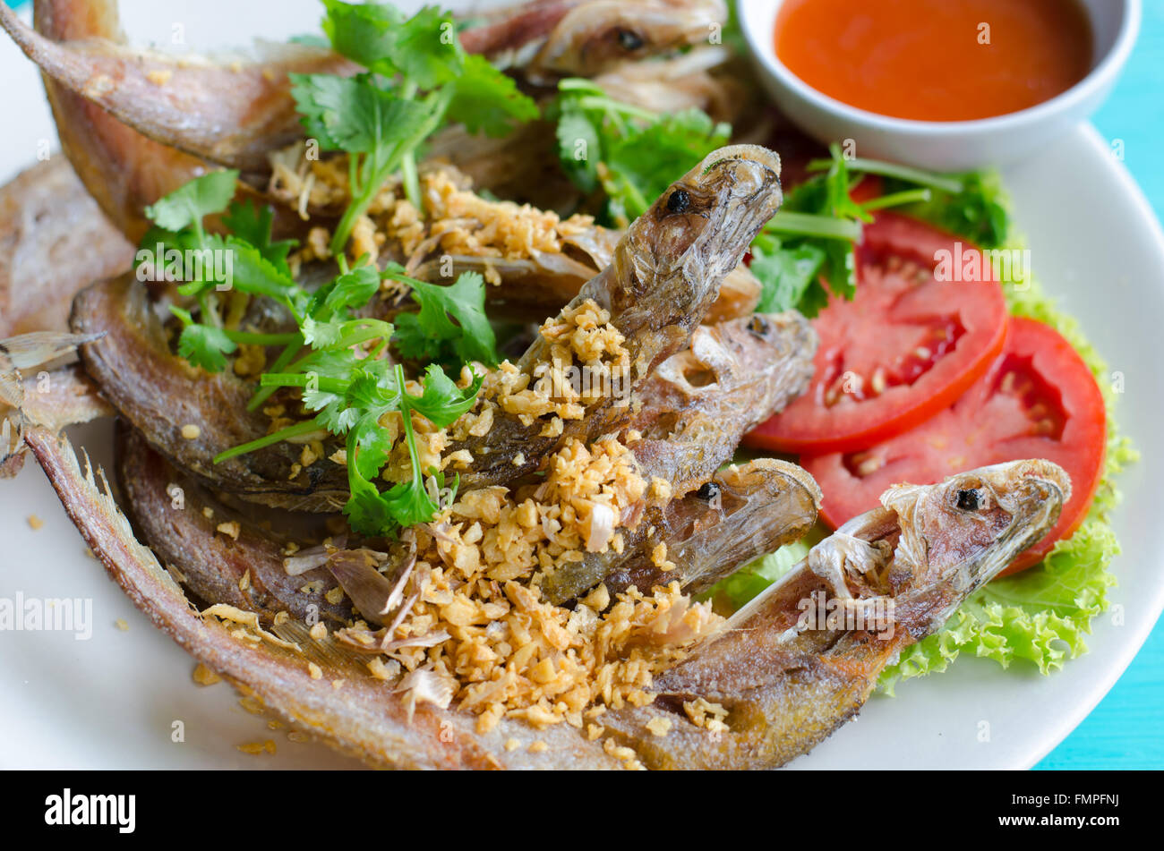 Fried River Fish with Garlic and Pepper Stock Photo - Alamy