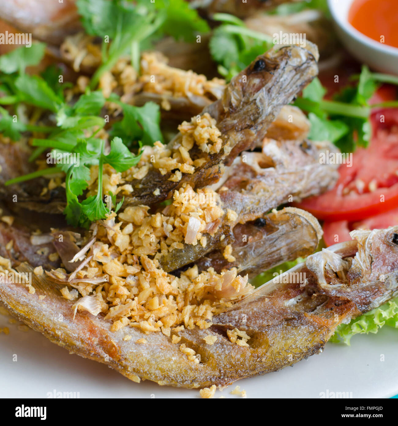 Fried River Fish with Garlic and Pepper Stock Photo - Alamy
