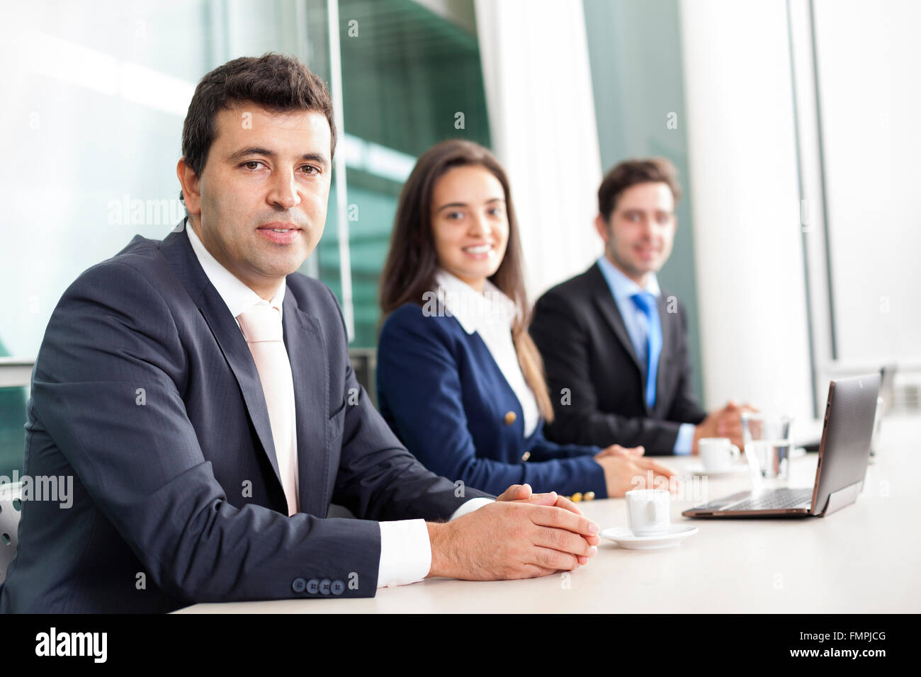 Business team smiling at the office, lined up Stock Photo - Alamy