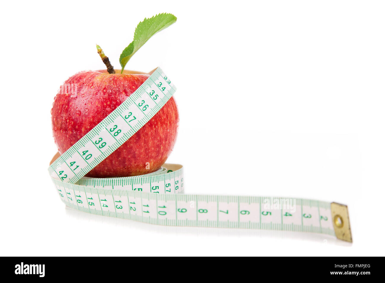 Red apple and measuring tape on a white background Stock Photo - Alamy