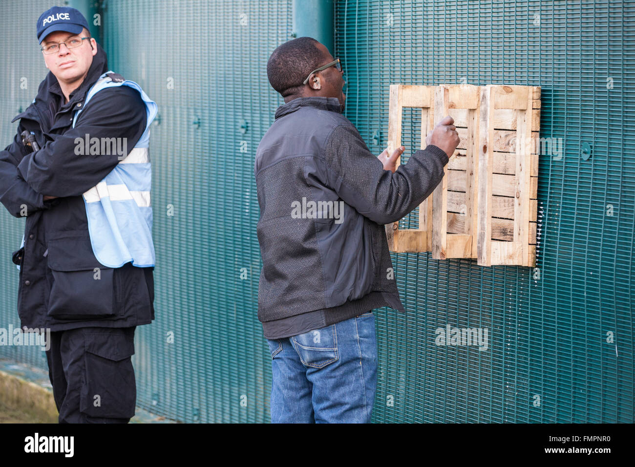 Milton Ernest, UK. 12th March, 2016. A man strikes the inner perimeter ...