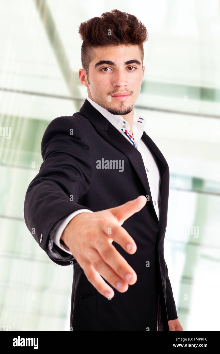 Business man giving hand for handshake Stock Photo - Alamy