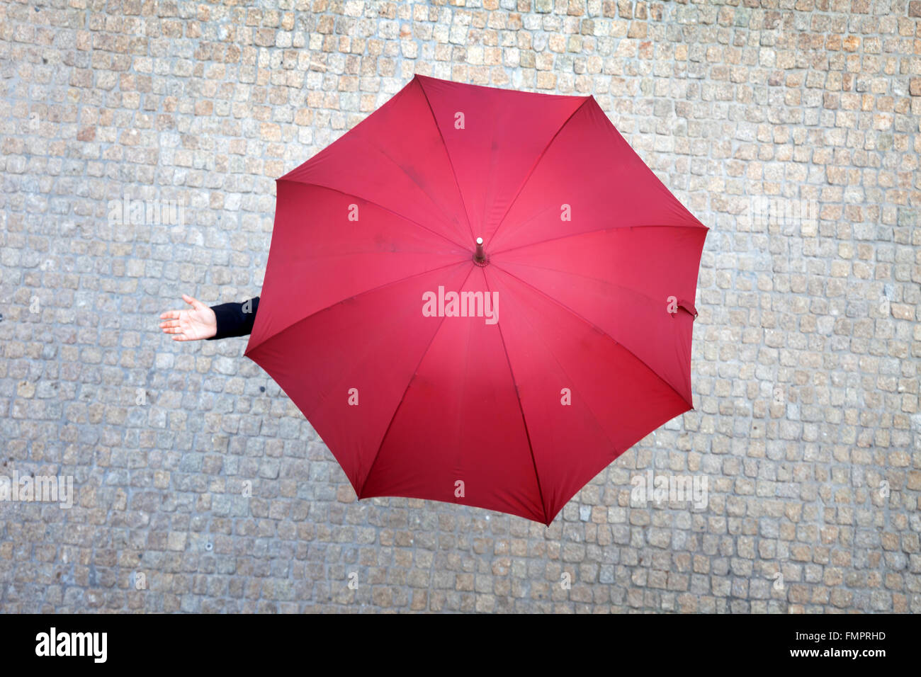 Business woman hidden under umbrella and checking if it's raining Stock ...