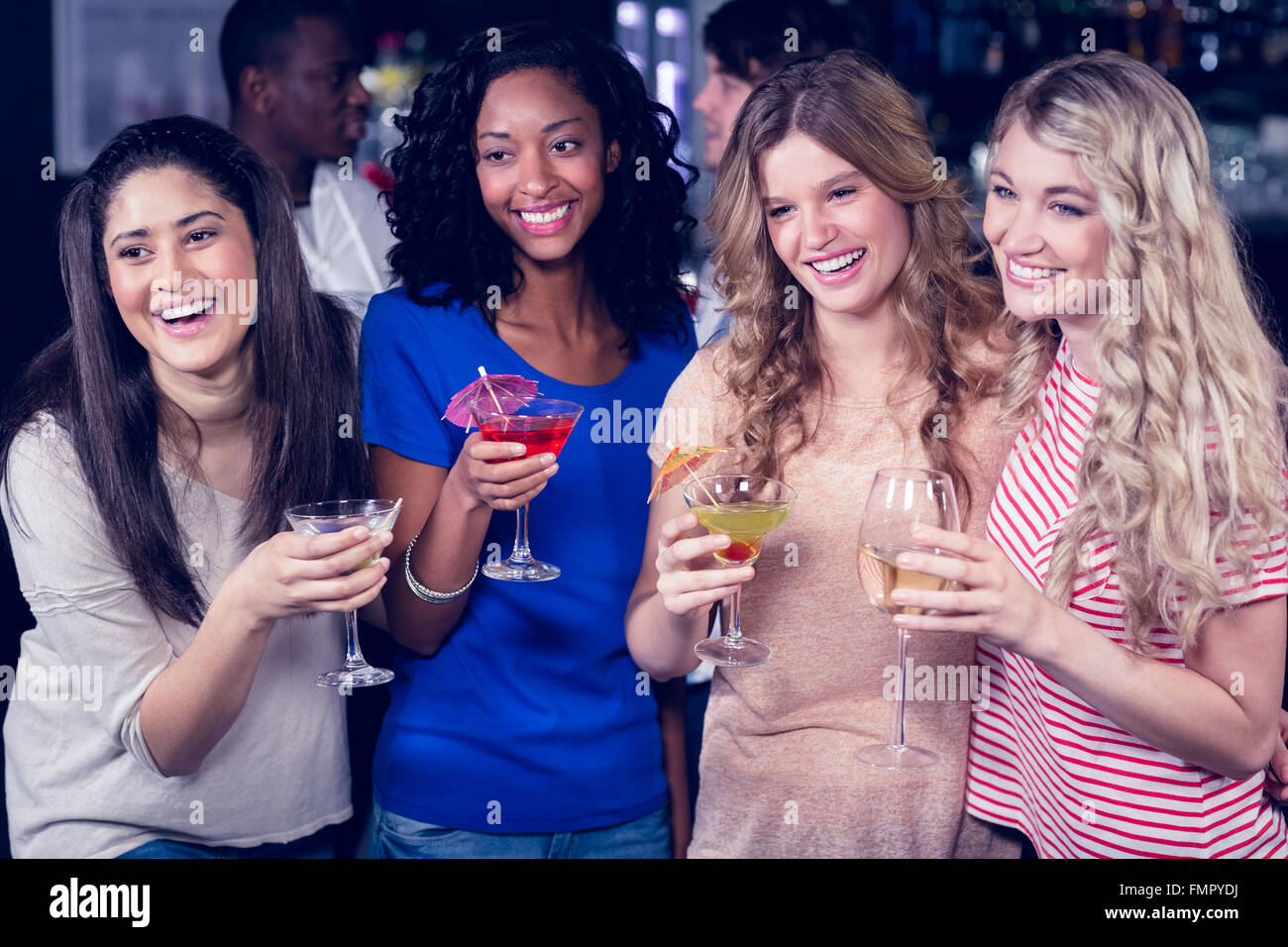 Friends drinking cocktails together Stock Photo - Alamy
