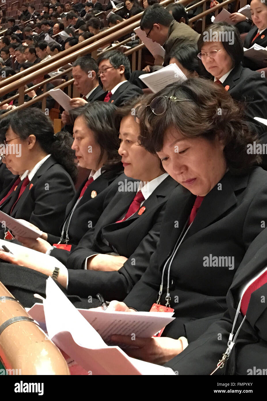 Beijing, China. 13th Mar, 2016. Staff members of the Supreme People's ...