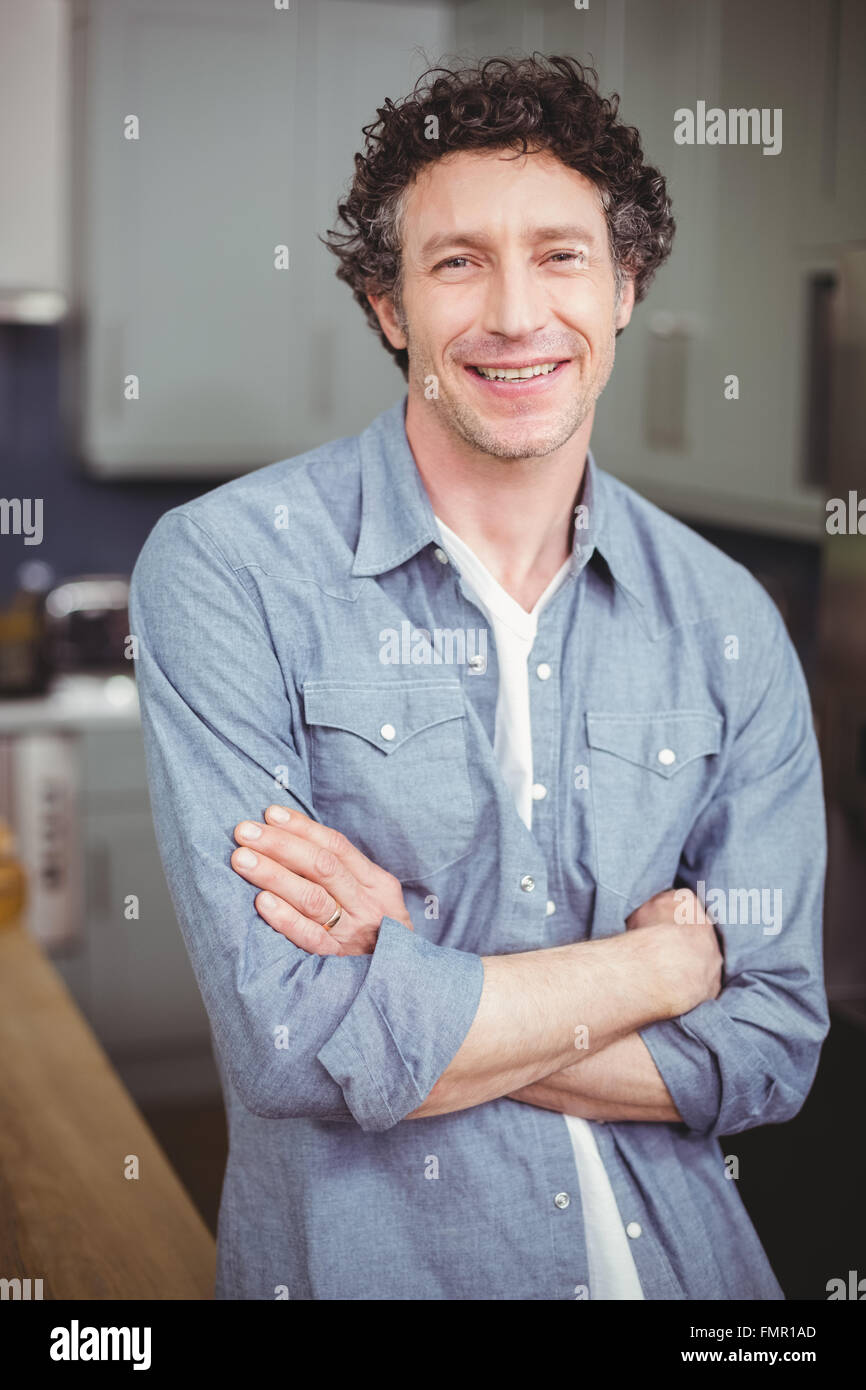 Portrait of smiling young man in kitchen Stock Photo - Alamy